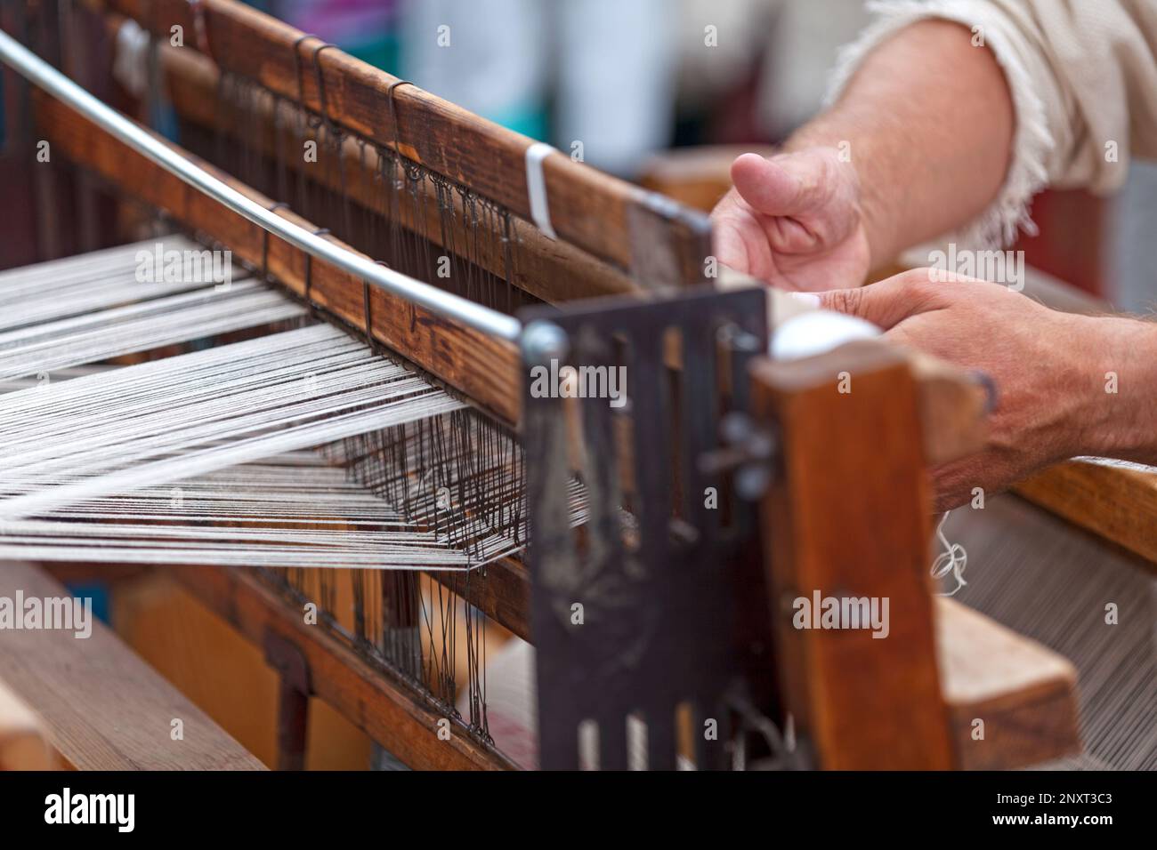 A weaver is a craftsman who weaves various types of yarn into fabrics ...