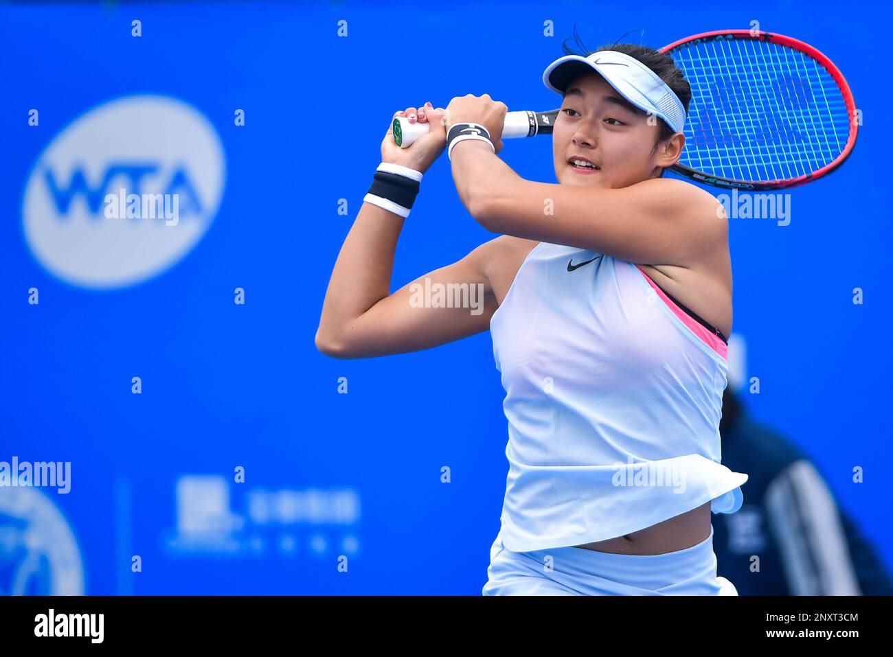 Wang Yafan of China returns a shot to Jasmine Paolini of Italy in their ...