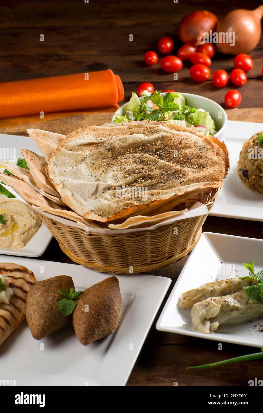 arab banquet with hommos, labneh, chancliche, pita bread, fatouch ...