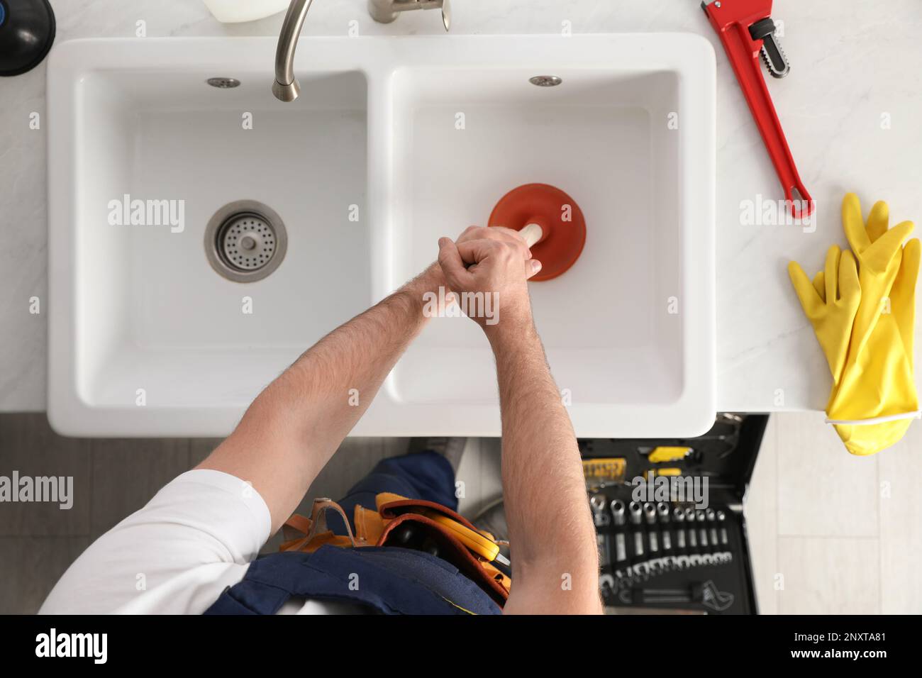 Hands plumber sink wrench hi-res stock photography and images - Alamy