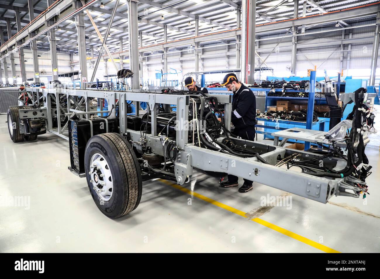 Suez, Egypt. 1st Mar, 2023. Employees work at a bus assembly plant co ...