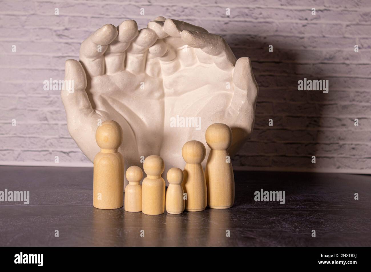 The young man used both of his hands to protect from the falling wooden ...