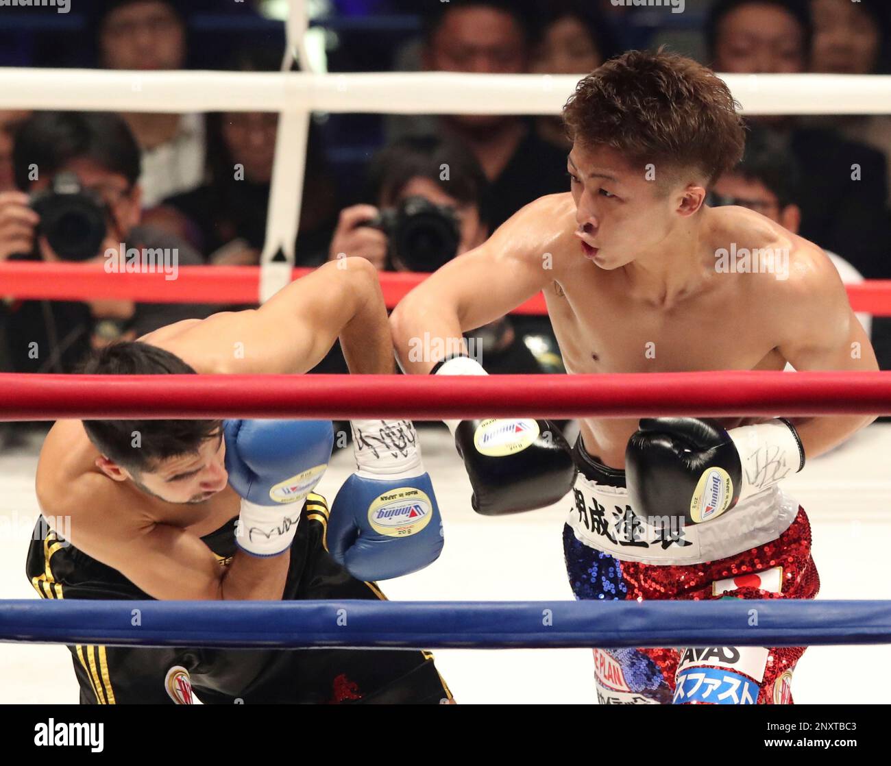 Japan's Naoya Inoue (R) attacks against French Yoan Boyeaux in the first round of a WBO world ...