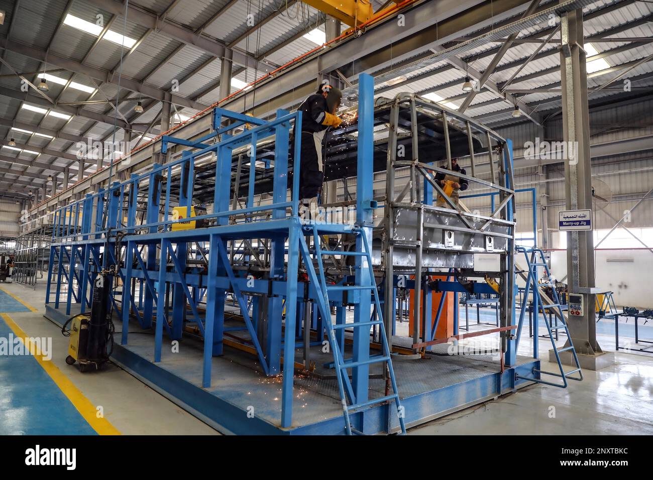 Suez, Egypt. 1st Mar, 2023. Employees work at a bus assembly plant co-built by Chinese and Saudi ...
