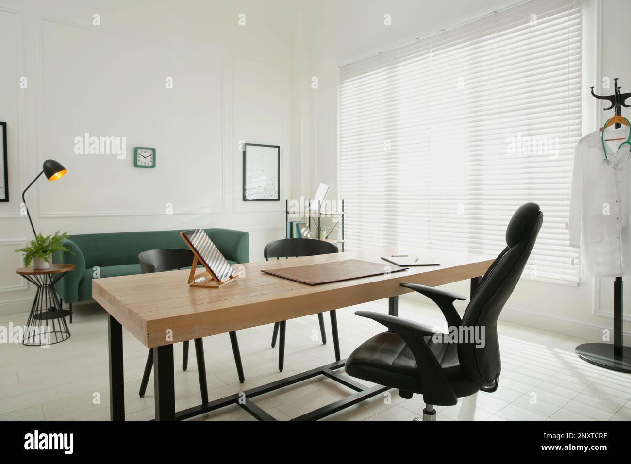 Modern medical office interior with doctor's workplace and sofa Stock ...