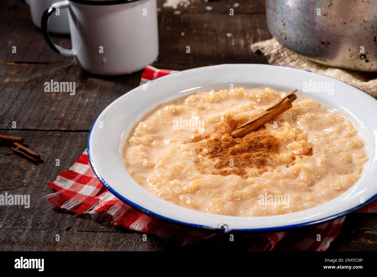 sweet rice served in rustic dish, pot and cups of coffee in the ...