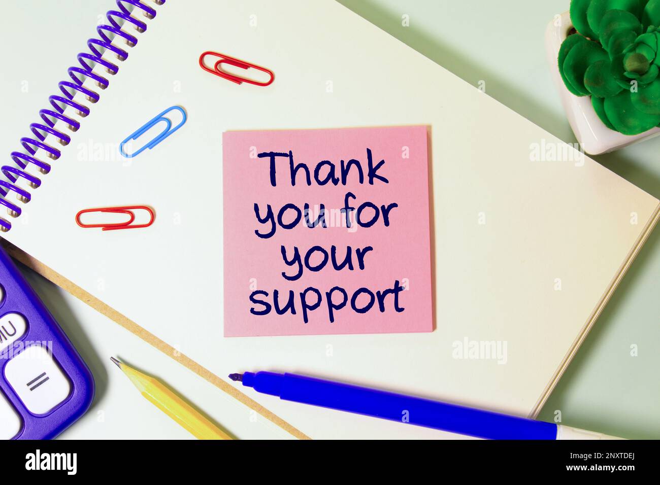 Thank you for your support text write on paper as background with pen ...