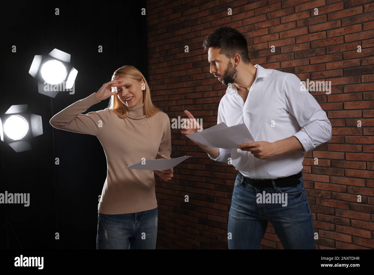 Professional actors rehearsing on stage in theatre Stock Photo - Alamy