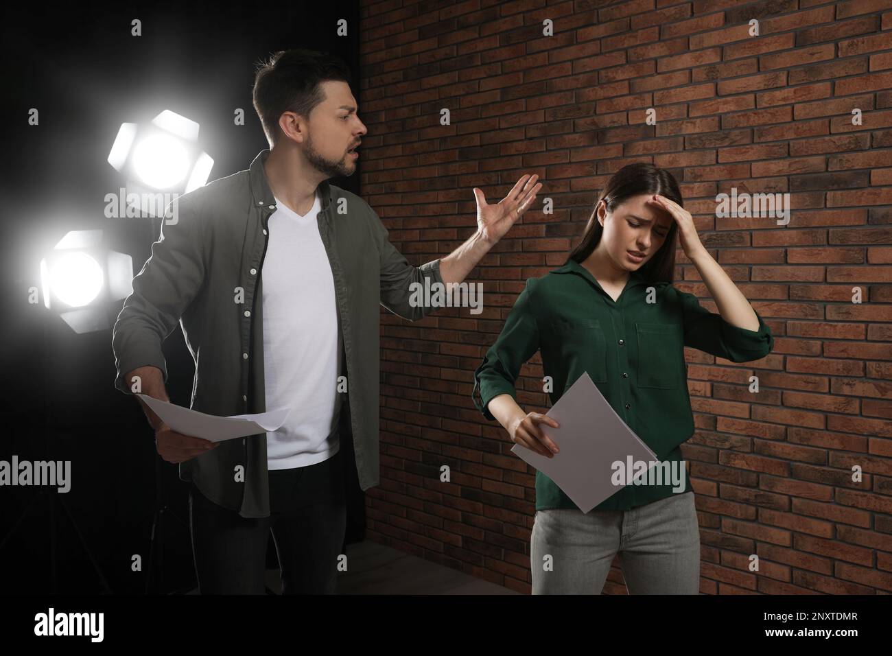Professional actors rehearsing on stage in theatre Stock Photo - Alamy