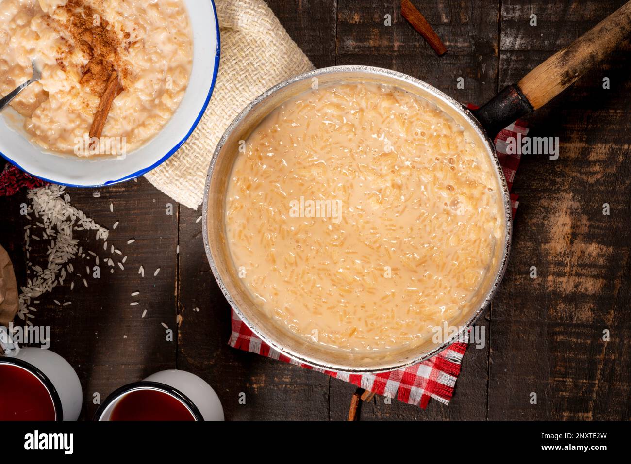 sweet rice served in rustic dish, pot and cups of coffee in the ...