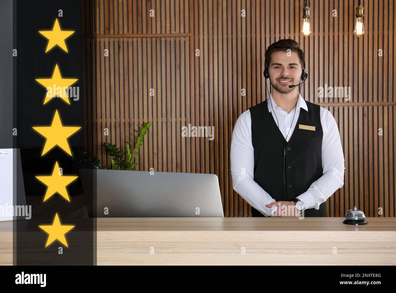 Five Star Luxury Hotel. Portrait of receptionist at desk in lobby Stock ...