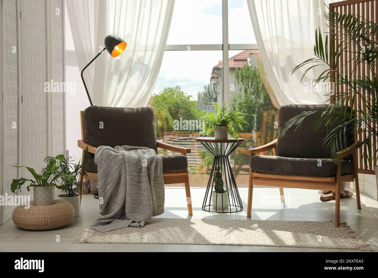 Indoor terrace interior with stylish furniture and houseplants Stock ...