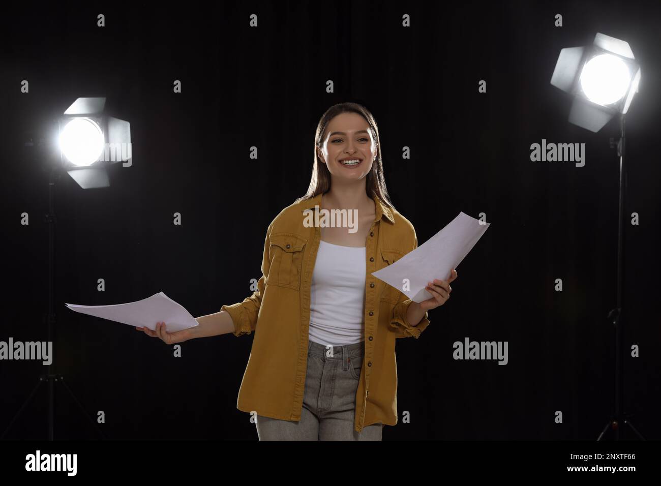 Professional actress reading her script during rehearsal in theatre ...