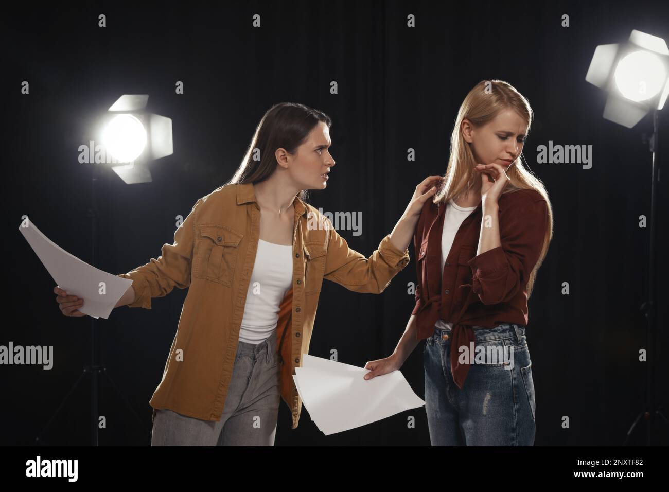 Professional actresses rehearsing on stage in theatre Stock Photo - Alamy