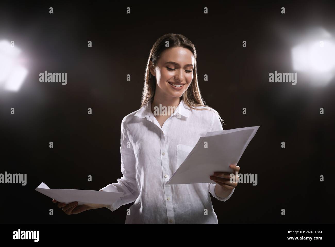 Professional actress reading her script during rehearsal in theatre ...