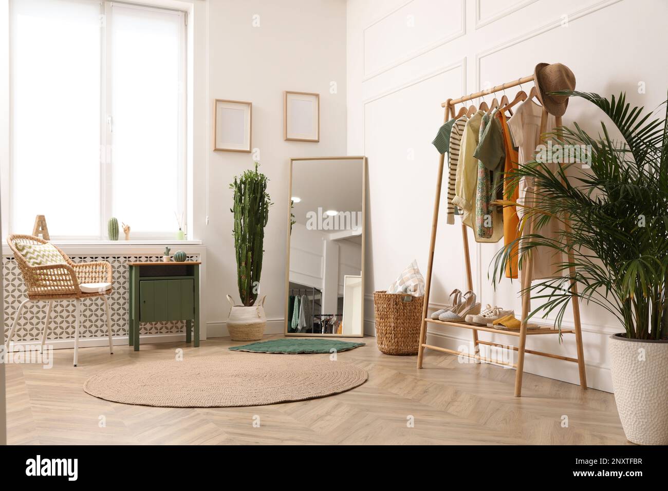 Modern room with clothes rack and big mirror. Interior design Stock ...
