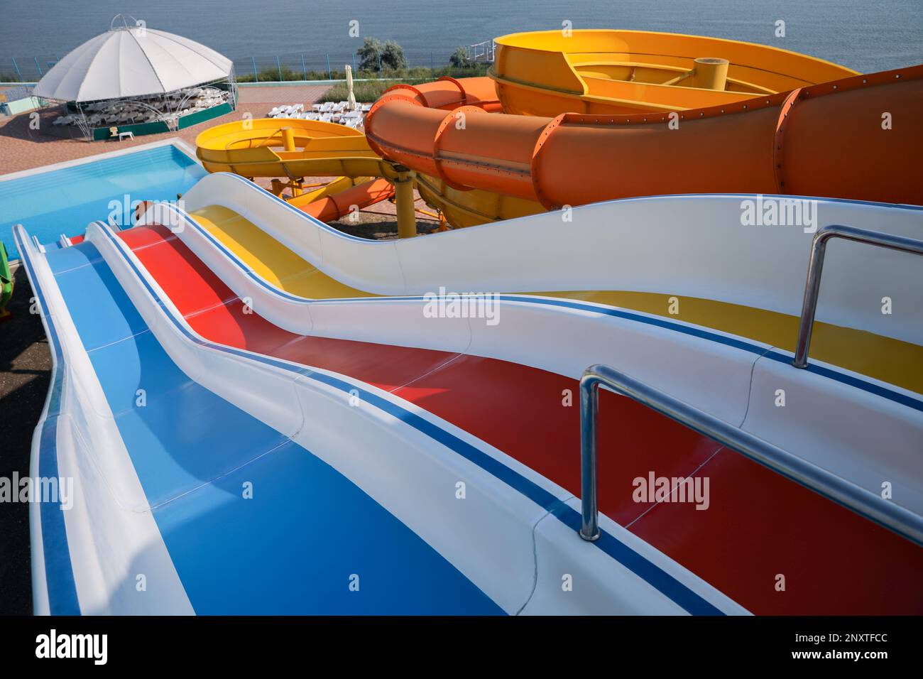 Modern water park yellow blue slide slides hi-res stock photography and ...