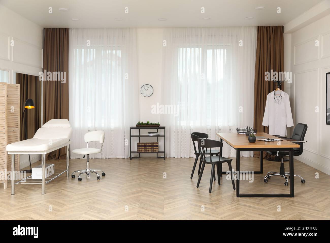 Modern medical office interior with doctor's workplace and examination ...