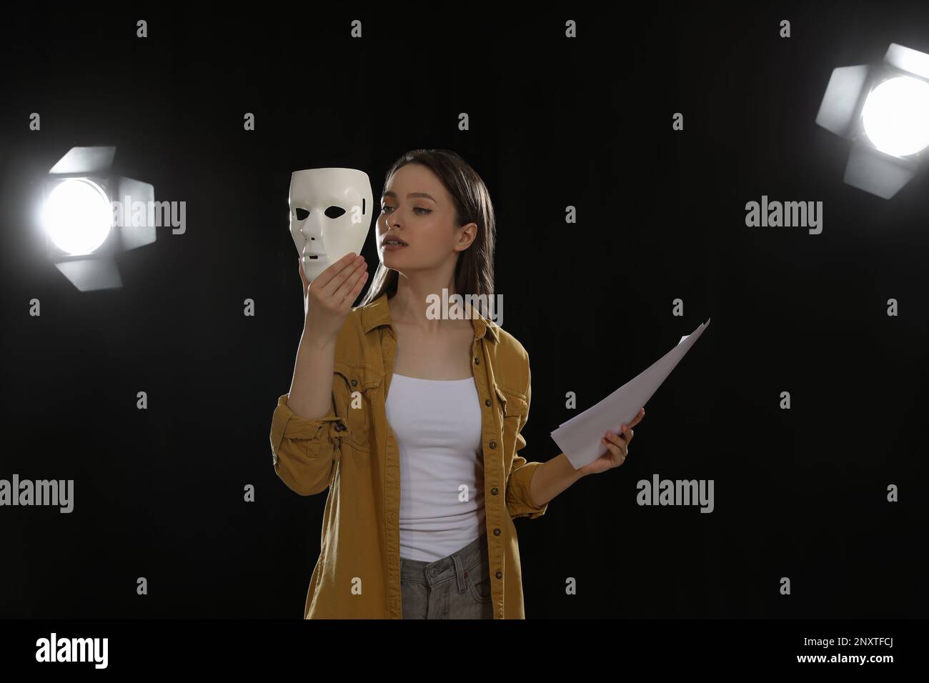 Professional actress reading her script during rehearsal in theatre ...