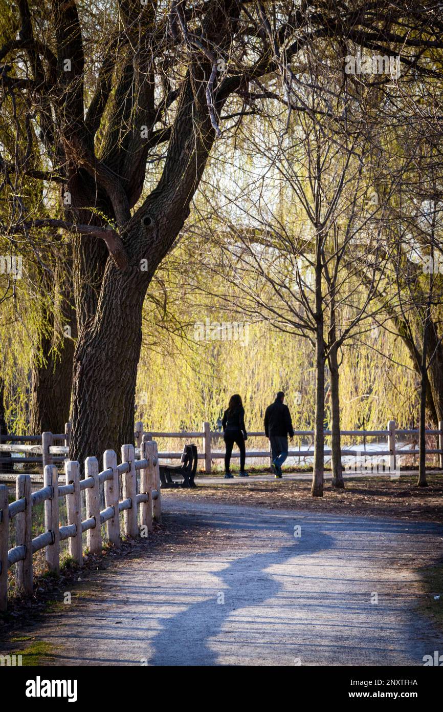 Couple out for an early morning trail walk Stock Photo - Alamy