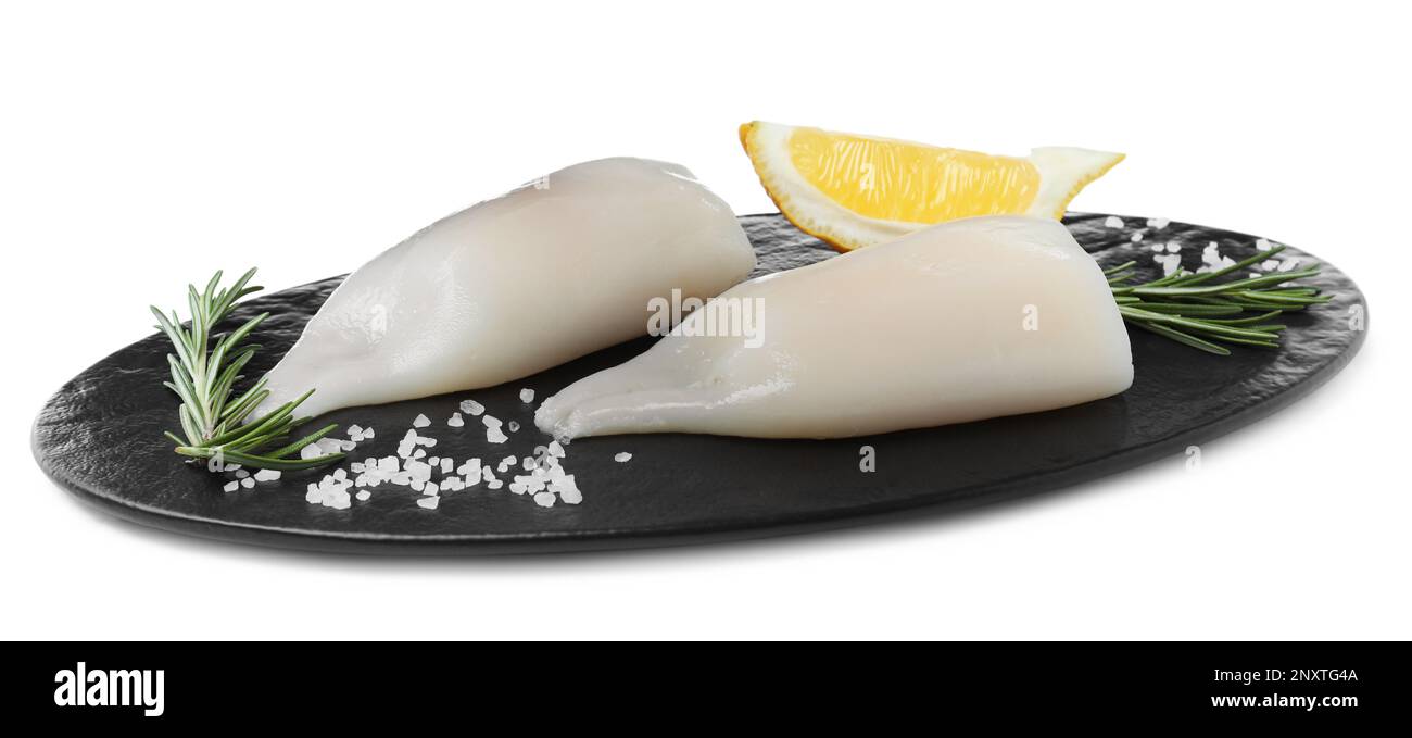 Fresh raw squid tubes with lemon, rosemary and salt on white background ...