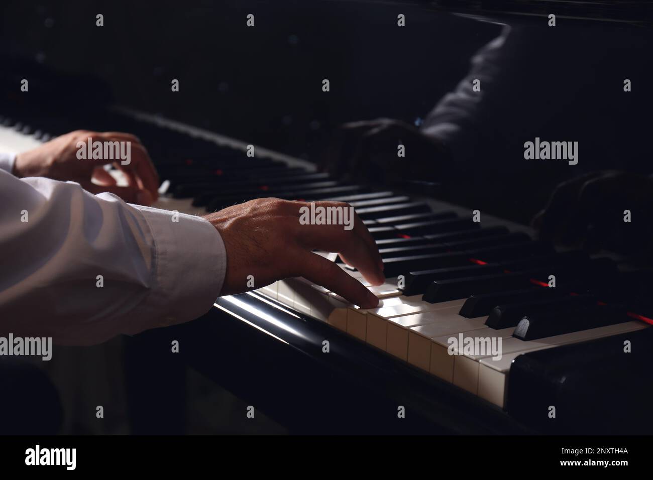 Man playing grand piano, closeup. Talented musician Stock Photo - Alamy