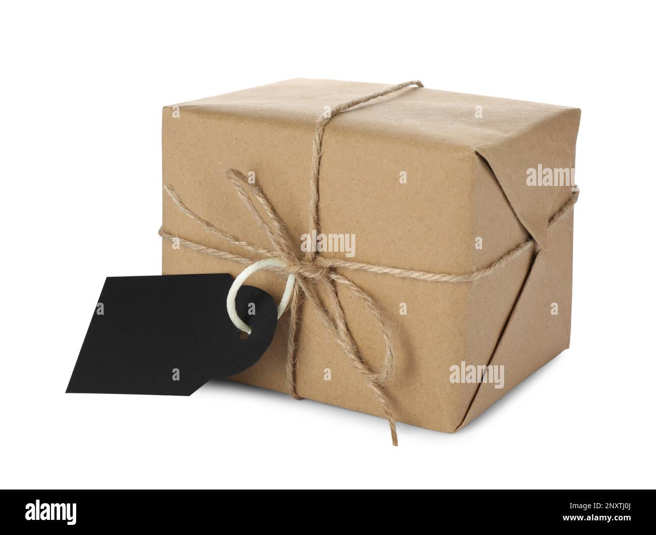 Parcel wrapped in kraft paper with tag on white background Stock Photo ...