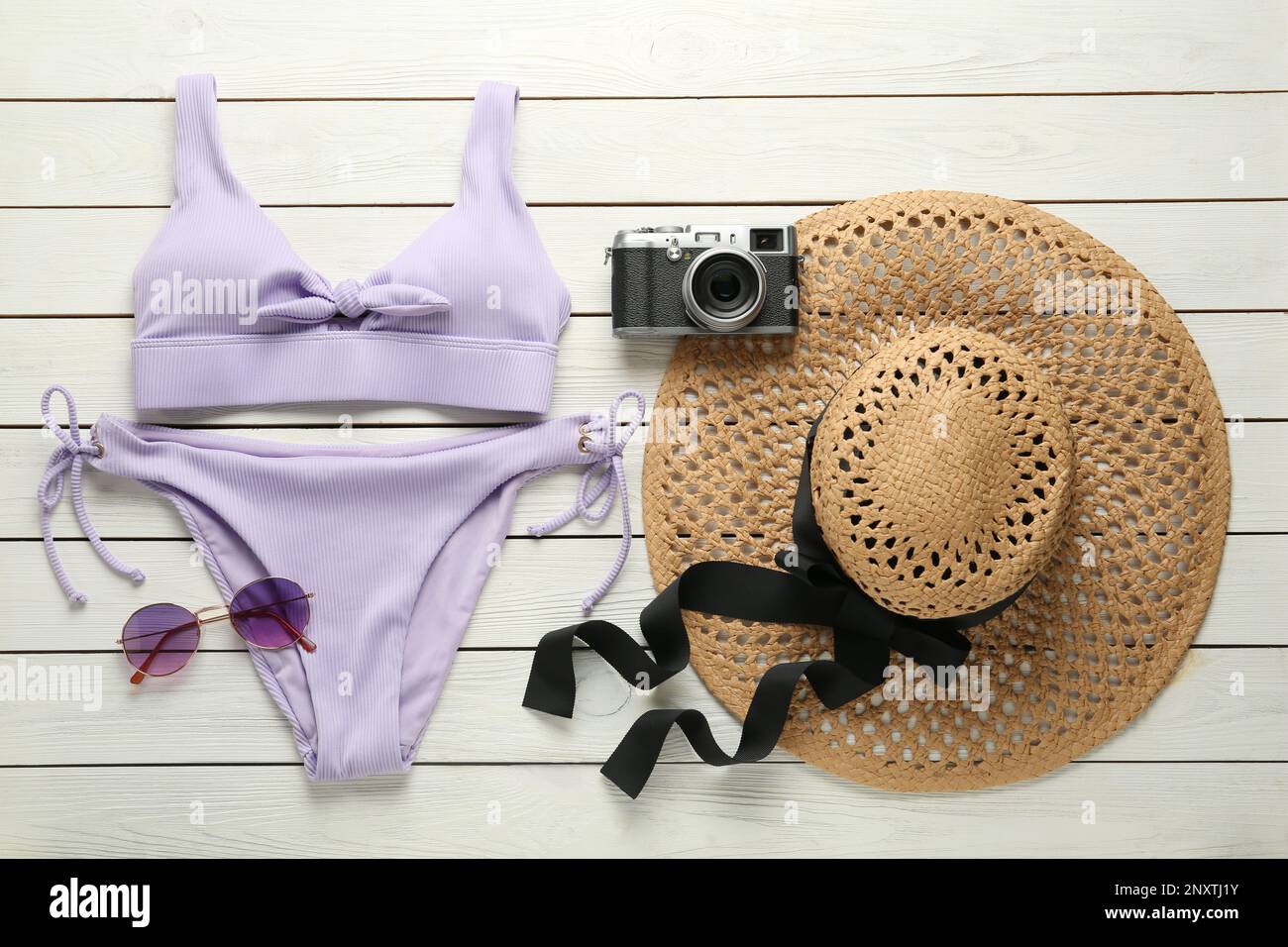 Flat lay composition with beach objects on white wooden background ...