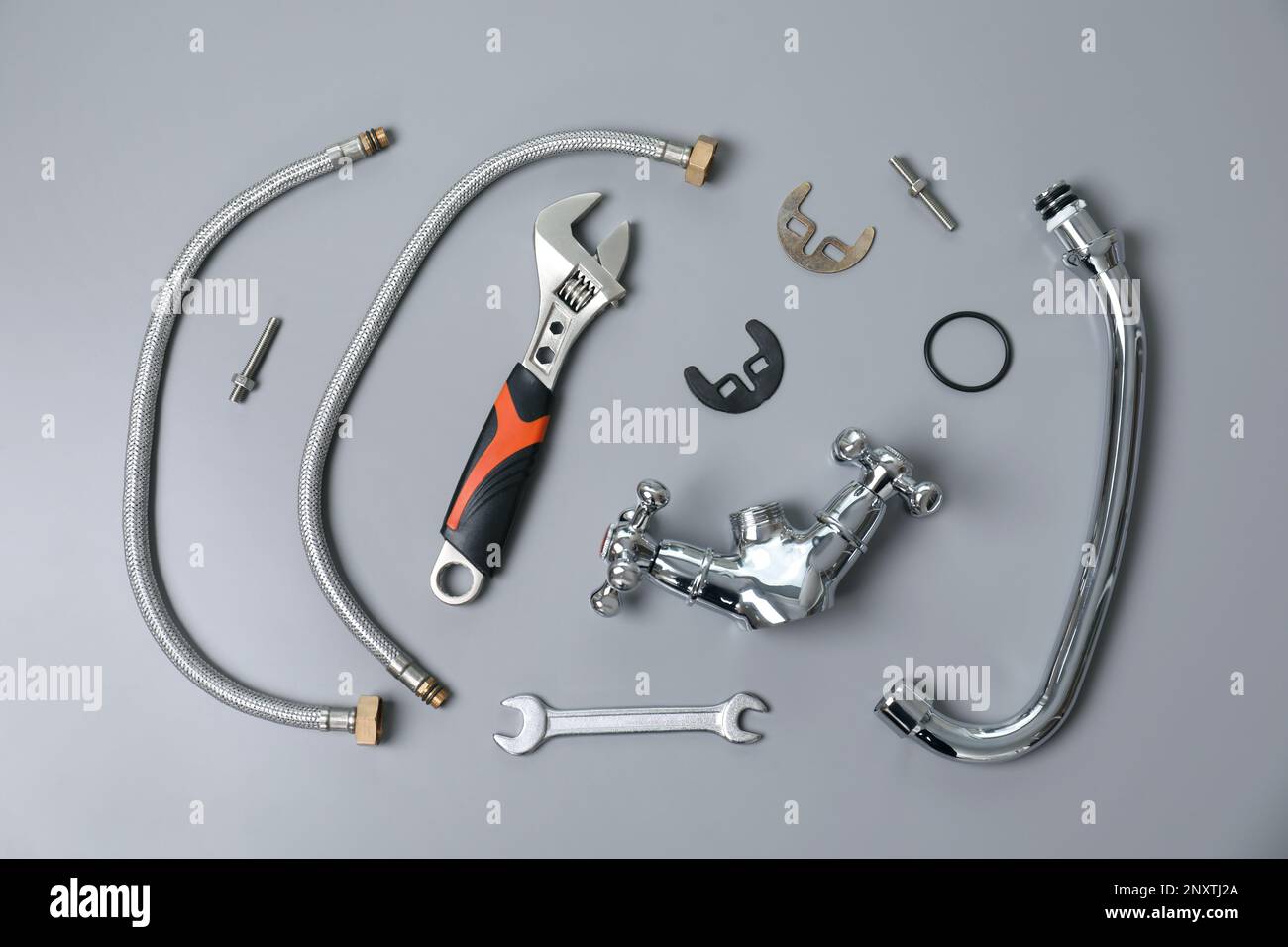 Parts of water tap and wrenches on grey background, flat lay Stock ...
