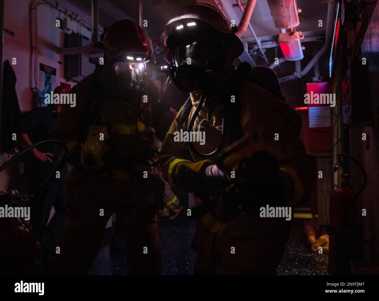 230120-N-XK047-1191 Damage Controlman 3rd Class Proy Royal, left, and ...