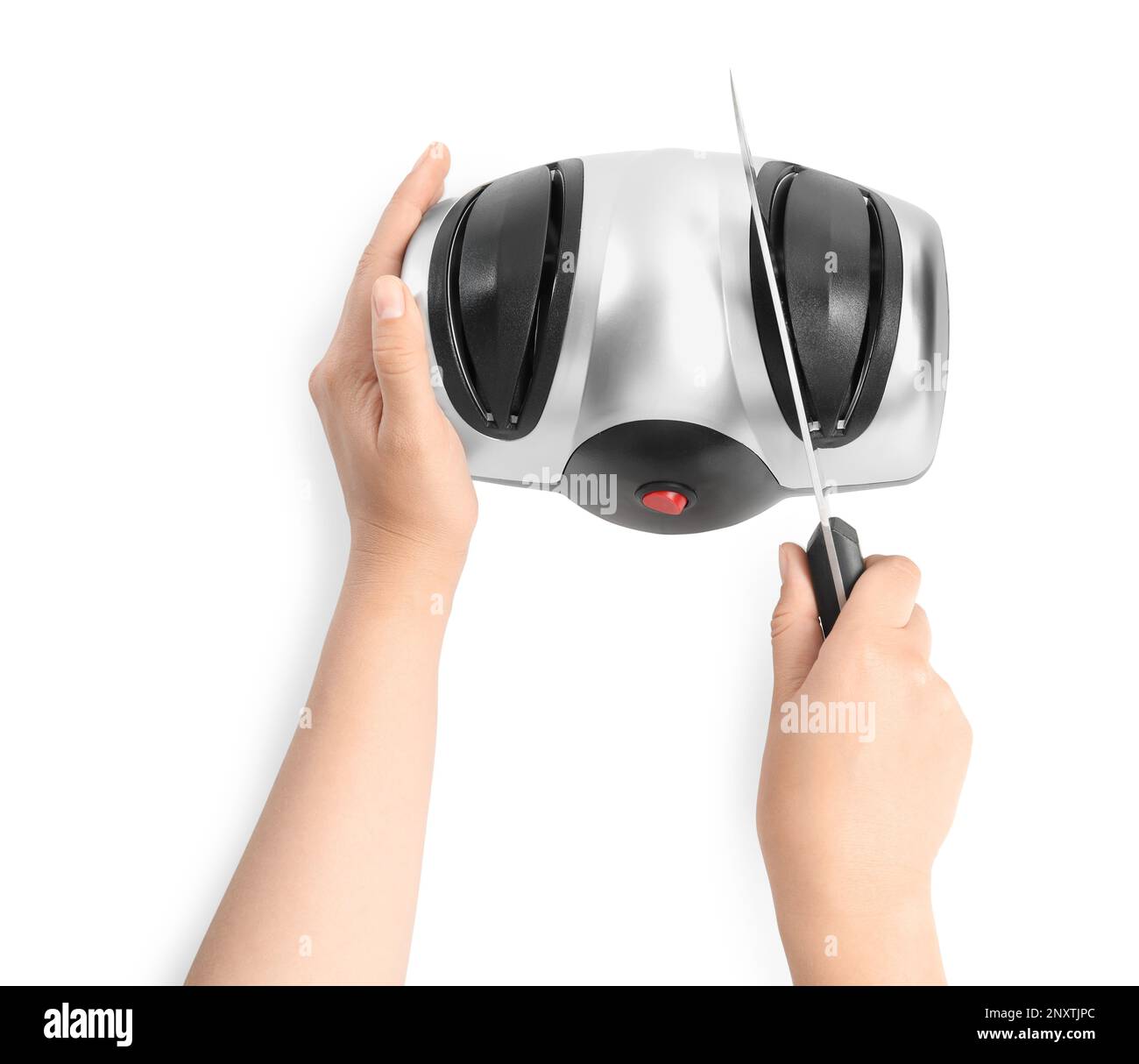 Woman sharpening knife with electrical tool on white background, top ...