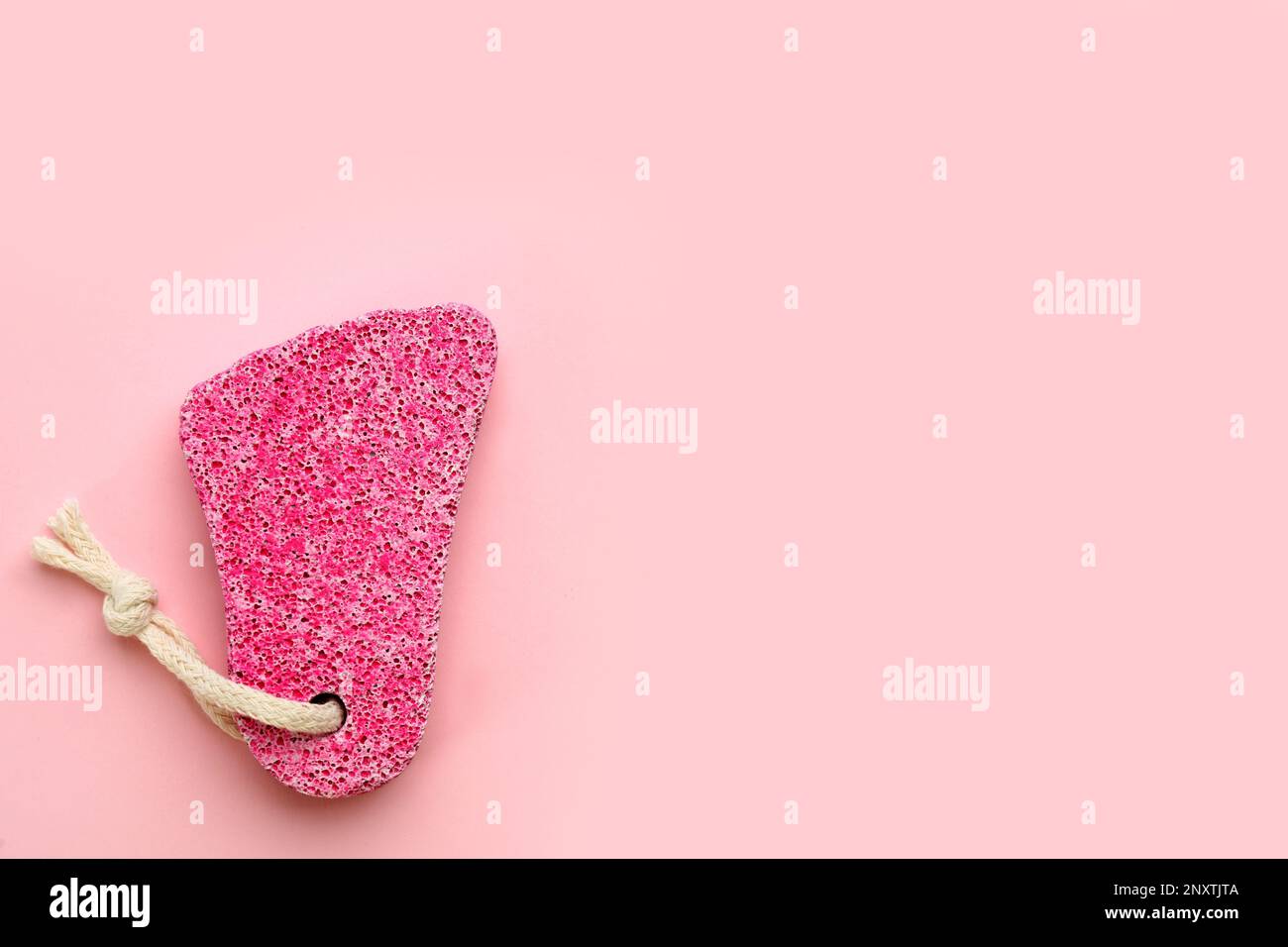 Color pumice stone on pink background, top view. Space for text Stock ...