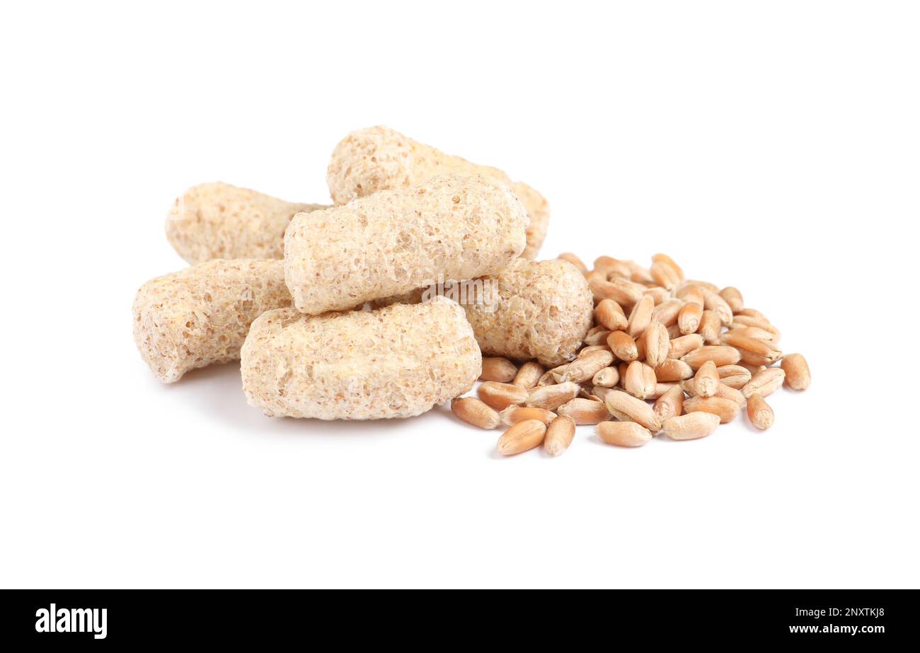 Granulated wheat bran and kernels on white background Stock Photo - Alamy