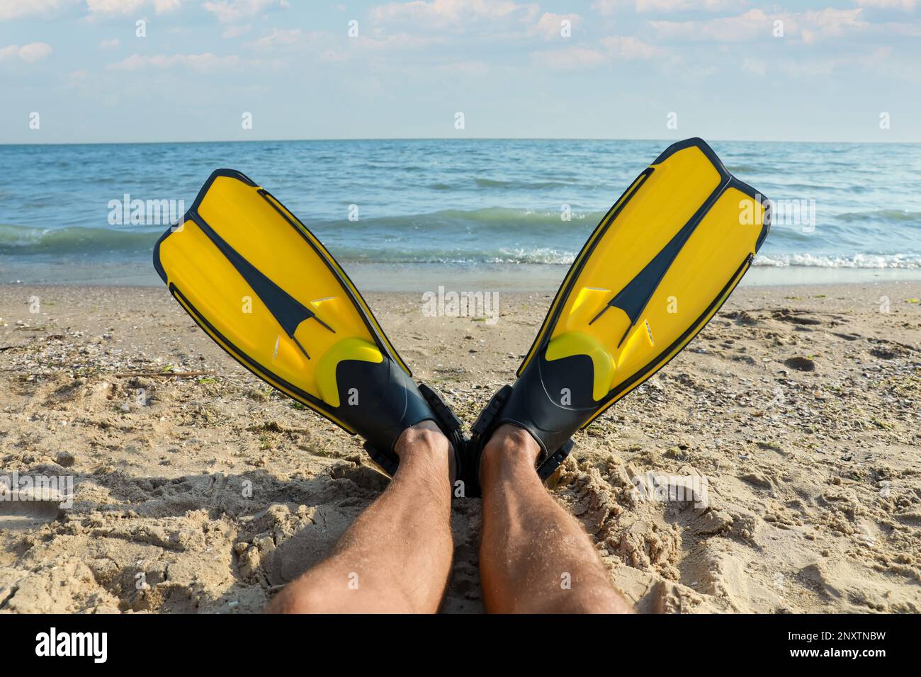 Male legs in yellow flippers hi-res stock photography and images - Alamy