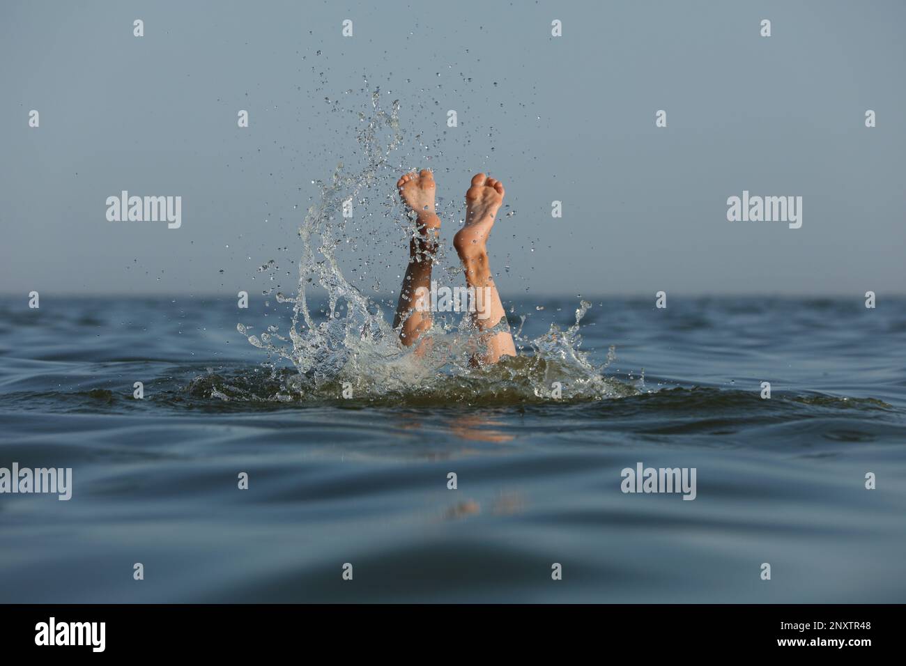Feet sticking out of water hi-res stock photography and images - Alamy