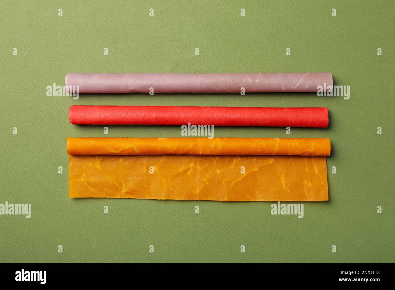 Colorful beeswax food wraps on light green background, flat lay Stock ...