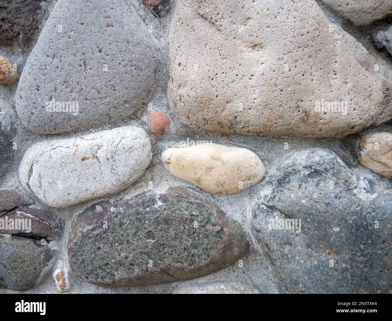 Background from cobblestones in cement. Interesting background. Unusual ...