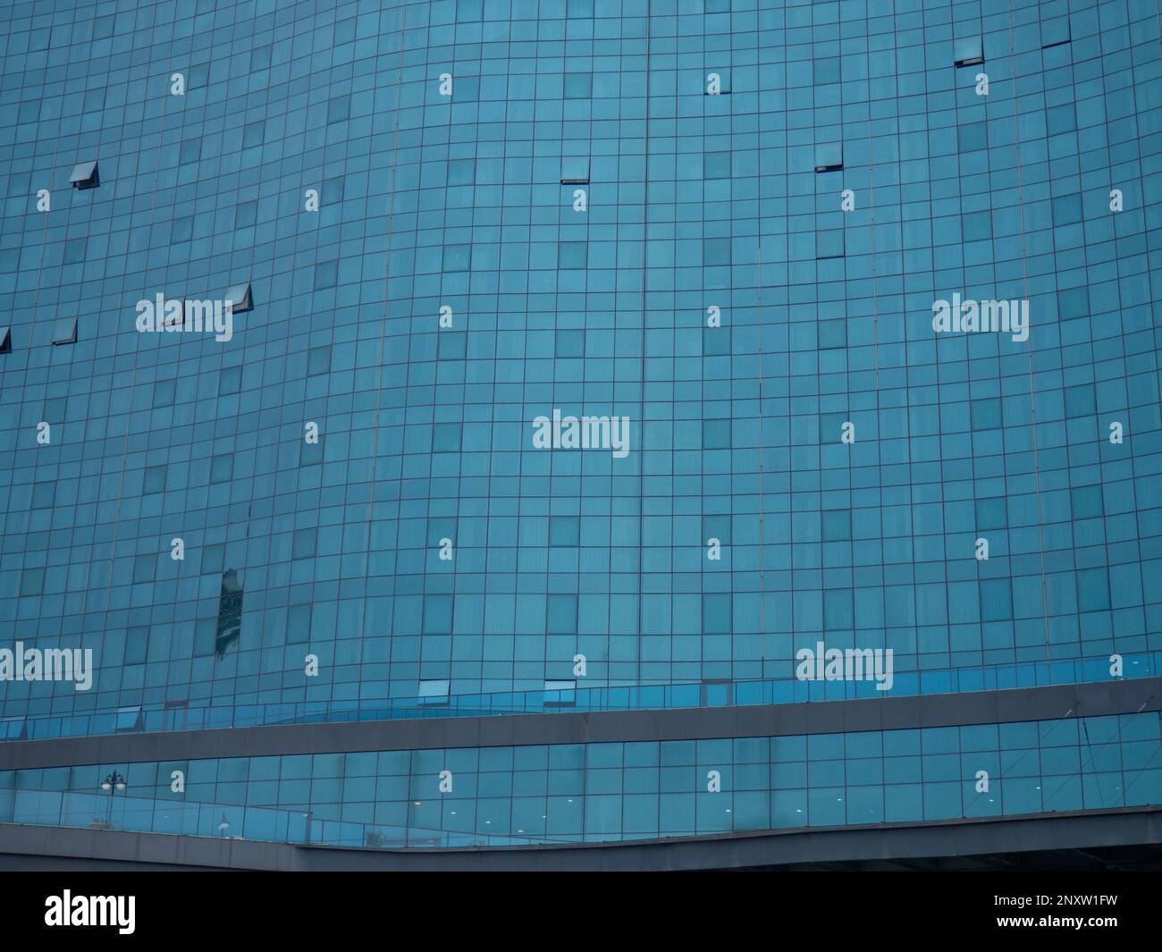 Windows of a modern hotel. Mirrored blue windows. Architecture pattern ...