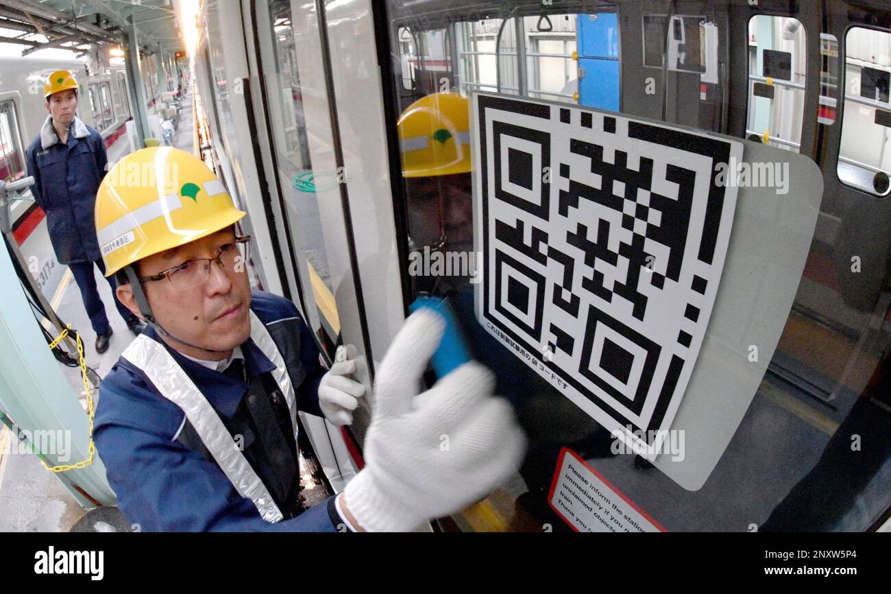 This photo shows a QR code sticker on a subway train that controls the ...