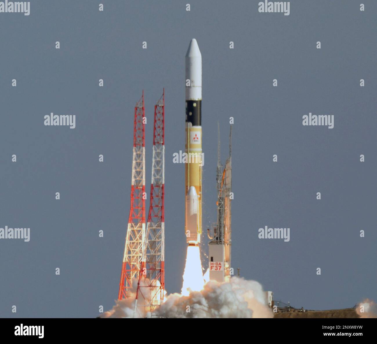 An H2A rocket No.37 carrying two satellites launches from Tanegashima ...