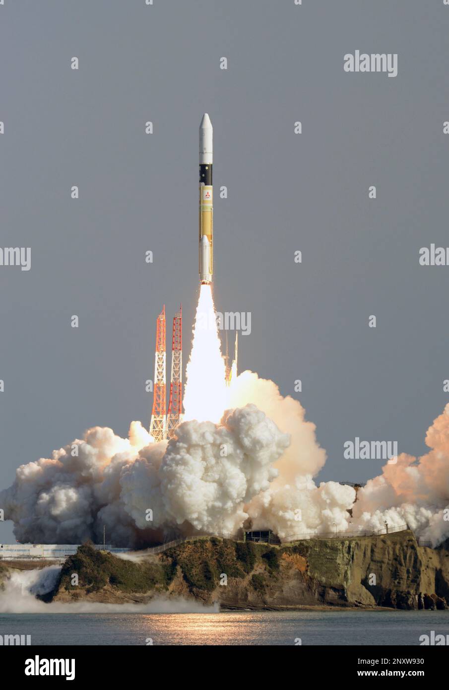 An H2A rocket No.37 carrying two satellites launches from Tanegashima ...