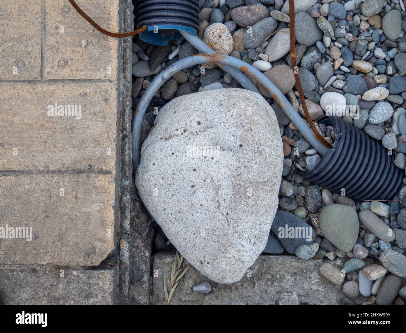 Wires on stones. Ground communications. Industry. Wiring Stock Photo ...