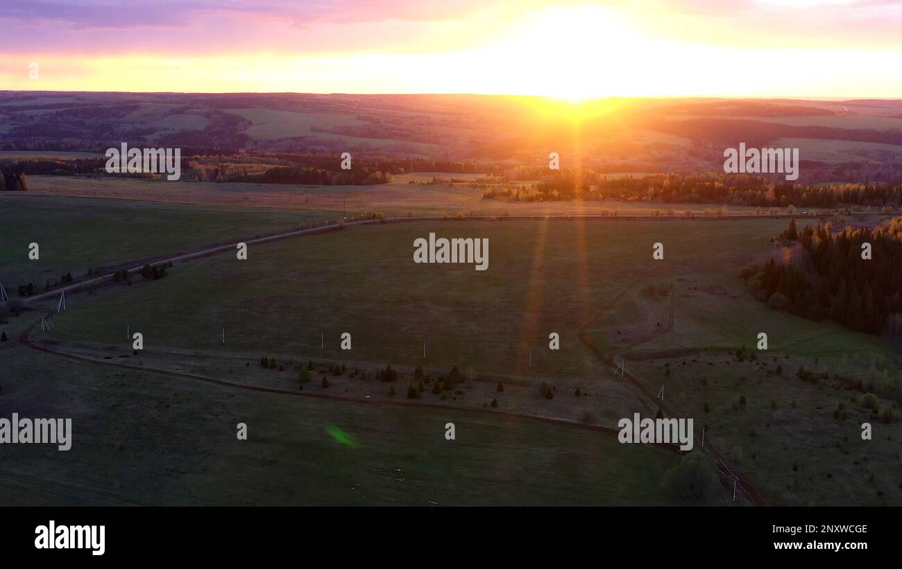 Aerial cinematic panoramic view of the farm field during sunset. Clip ...