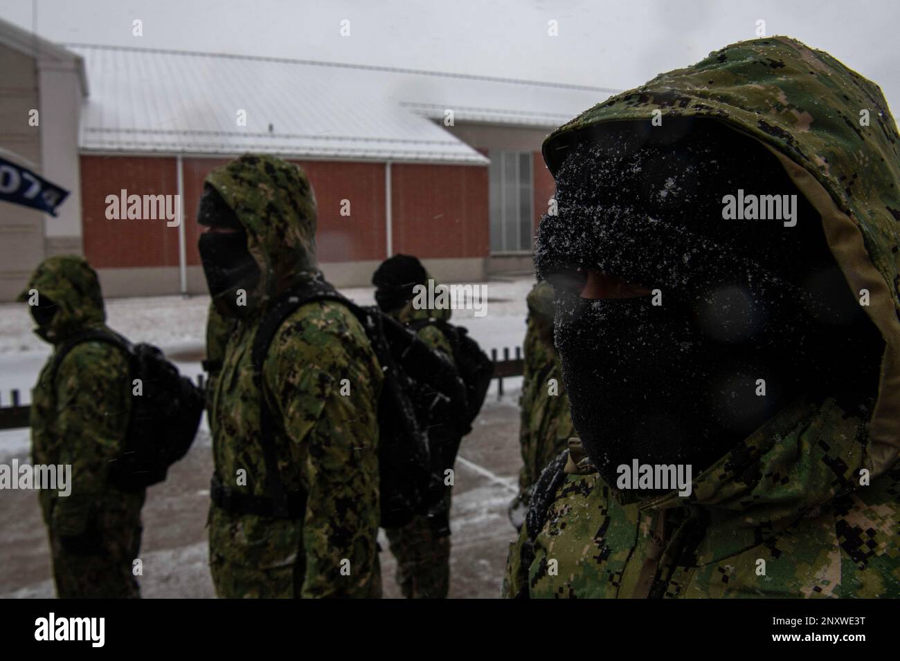 Recruits walk in formation during a snowstorm at Recruit Training ...