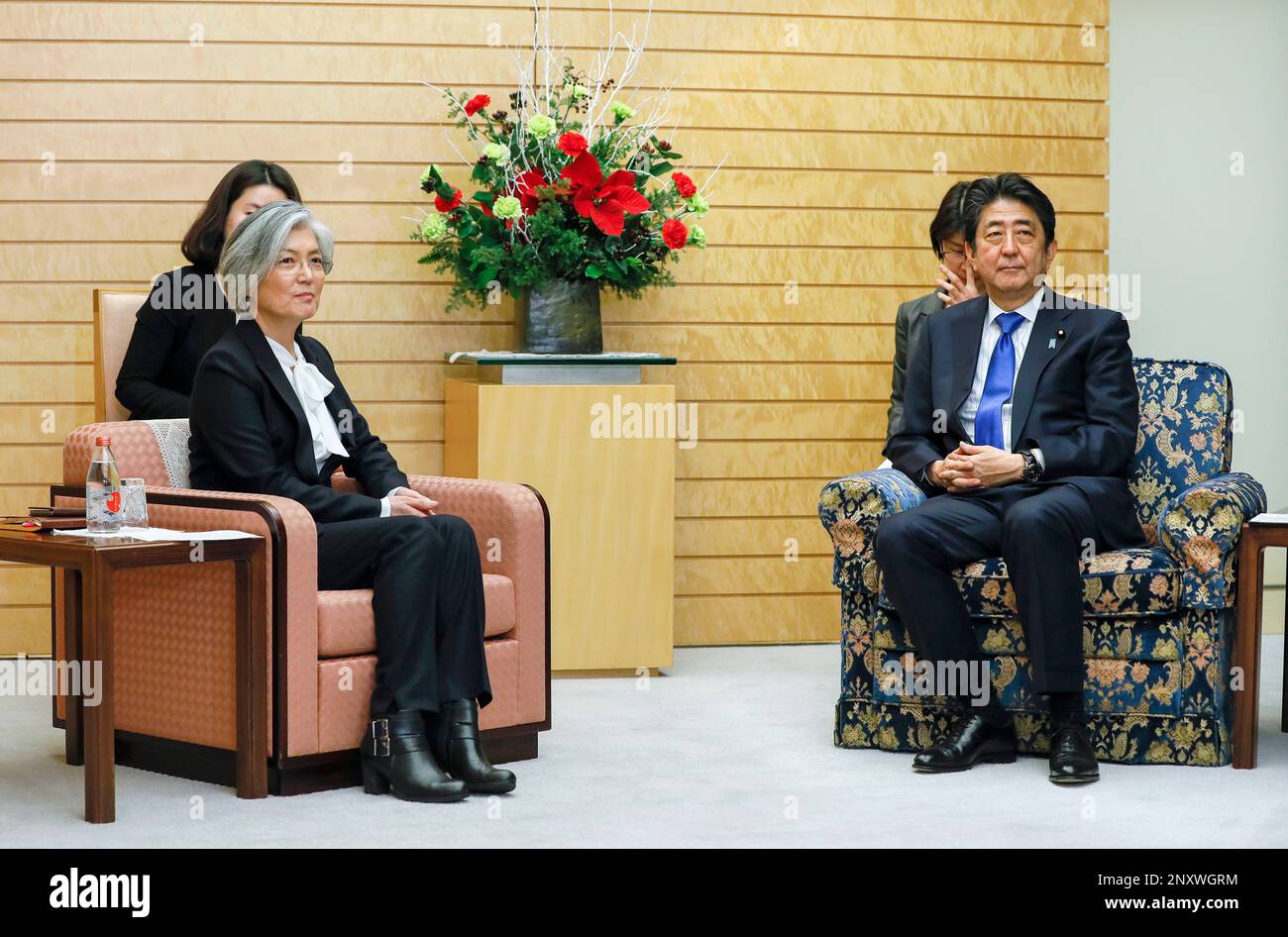 South Korean Foreign Minister Kang Kyung-wha, left, sits with Japanese ...