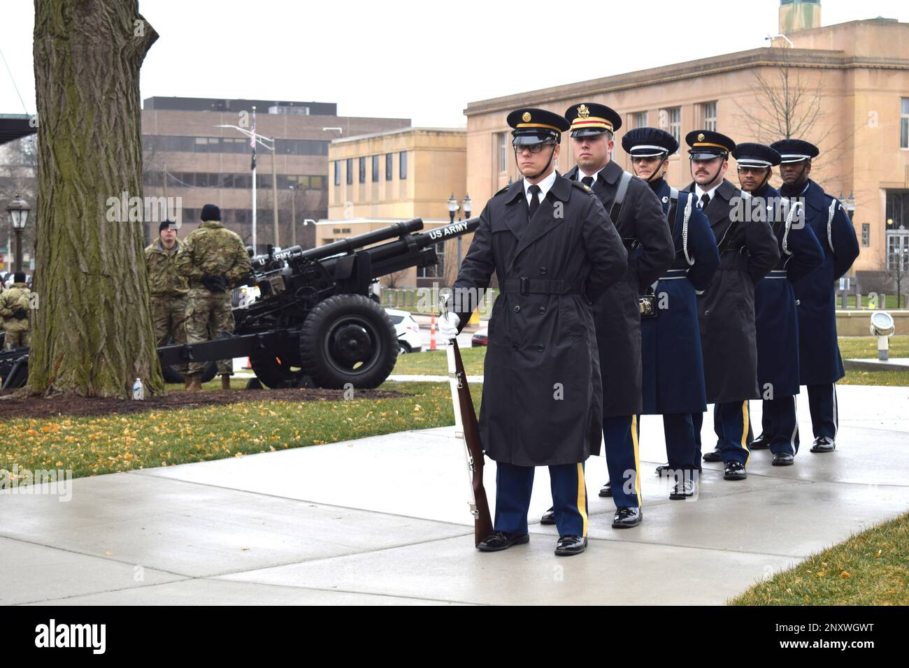 Members of the Michigan National Guard's Joint Color Guard prepare to ...
