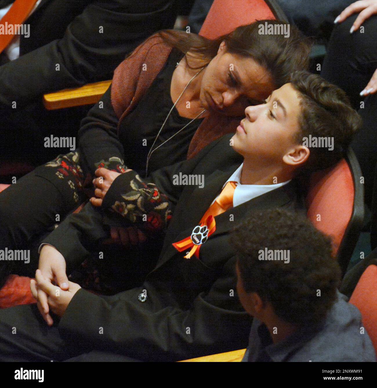 Jamie Lattin, left, leans on her son, Daniel Gillespie, during the ...