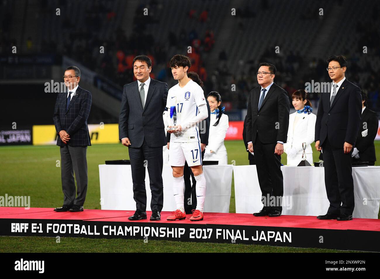 Lee Jaesung of South Korea poses on the podium after defeating Japan ...
