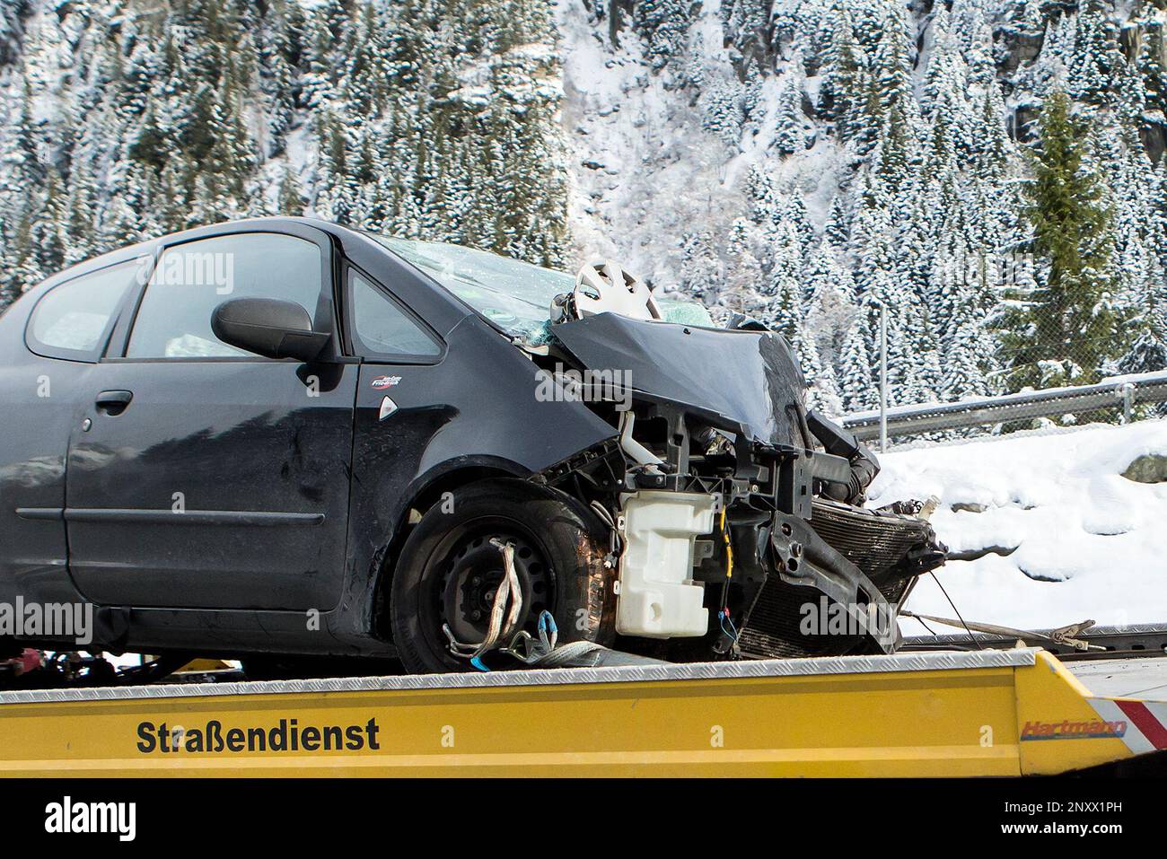 The accident vehicle is brought away in front of the north portal of ...