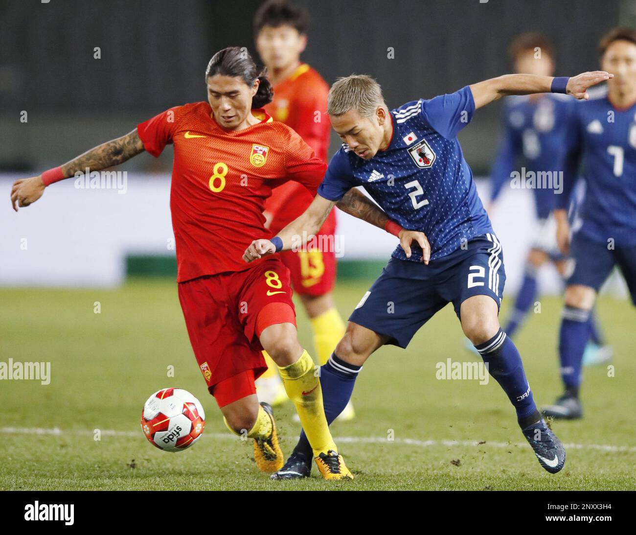 Japan's Yosuke Ideguchi, right, and China's Zhao Yuhao, left, fight for ...